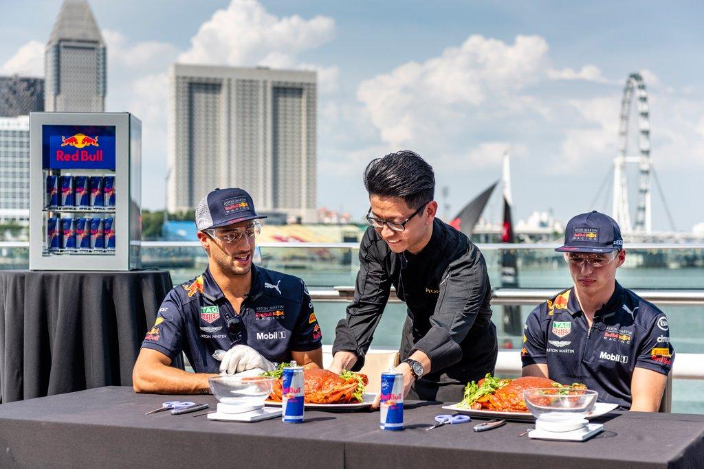 Red Bull racing drivers try to crack a chilli crab - Sgcarmart